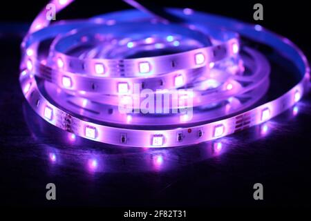 A closeup shot of a roll of illuminated purple led lights Stock Photo ...