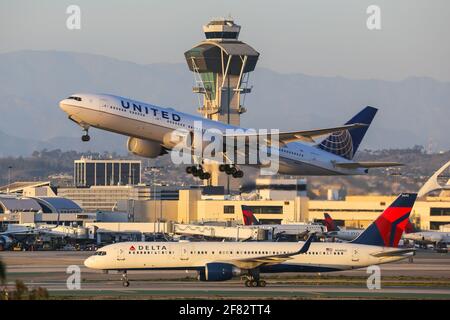 Delta Airlines Boeing 757 at LAX airport connected to jet bridge aerial ...