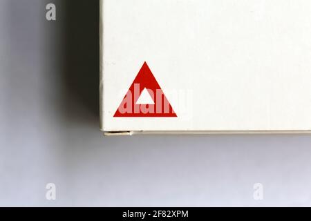 Red triangle pills Stock Photo - Alamy