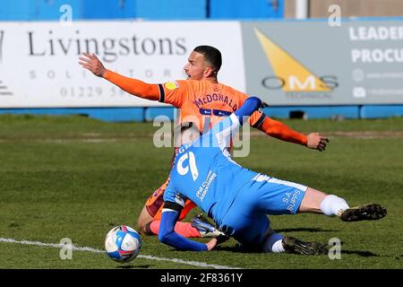 BARROW IN FURNESS, ENGLAND: Rod McDonald of Carlisle United battles ...