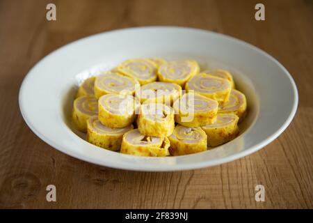 egg roll with fish paste on wooden background Stock Photo - Alamy