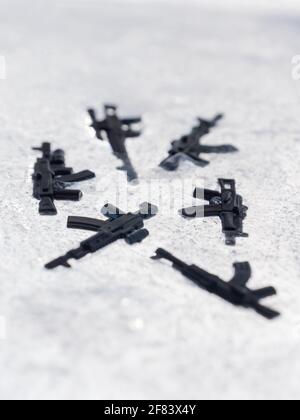 Toy guns on ice Stock Photo - Alamy