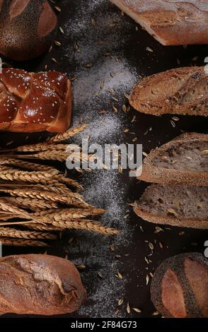 Many mixed breads and rolls shot from above. Top view of assortment of ...
