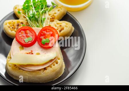 Reindeer shaped crumpets served with ham, tomato, cucumber, and ...