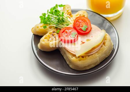 Reindeer shaped crumpets served with ham, tomato, cucumber, and ...
