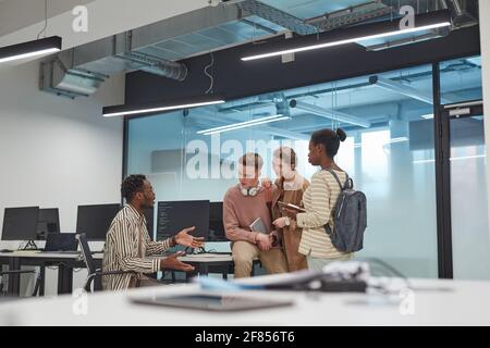 Wide angle view at diverse group of doctors in conference room ...