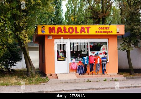 POZNAN, POLAND - Sep 12, 2013: Parked cars by apartment buildings Stock ...