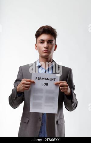 Graduate Man Holding Placard Isolated On gray Background Stock Photo ...