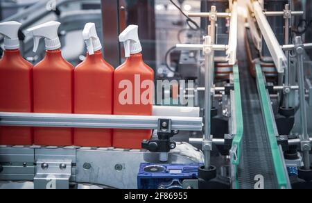 Production line of Liquid filling bottle machine Stock Photo - Alamy