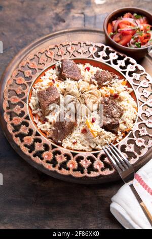 Asian traditional pilaf with beef and carrot Stock Photo - Alamy