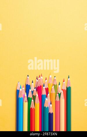 Colorful pencils and other art supplies in pail isolated on white Stock ...