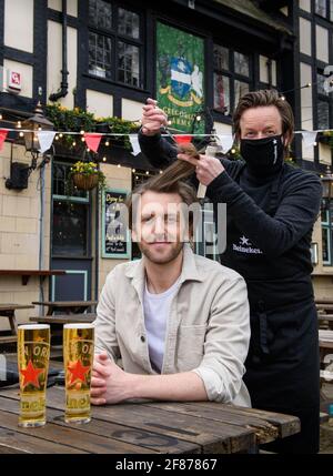 Editorial Use Only Joe Foyster receives a free haircut from Michael ...