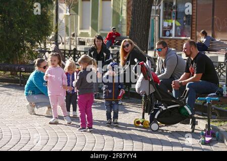 Ivano-Frankivsk, Ukraine April 1, 2021: A couple of people near a ...