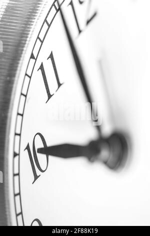 Classic analog clock pointing at ten forty, isolated on white ...