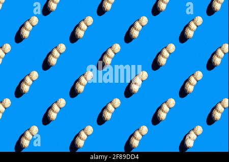 Pattern of cashew. Fashionable sunny porridge pattern on a bright blue ...