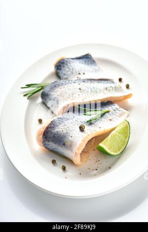 Salted herring marinated fillet with skin Stock Photo - Alamy
