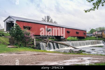 Bridgeton Covered Bridge spans a waterfall next to the original ...