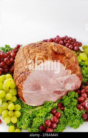 Whole pork ham with fresh fruits. Healthy food. Easter meal Stock Photo ...
