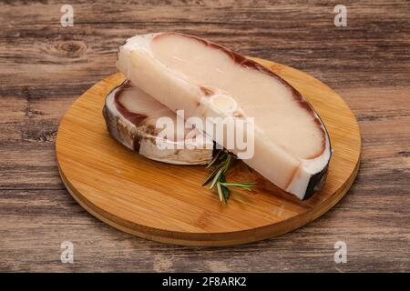 Raw shark steak served rosemary for cooking Stock Photo - Alamy