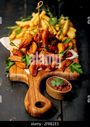 Appetizing fried potato wedges Stock Photo - Alamy