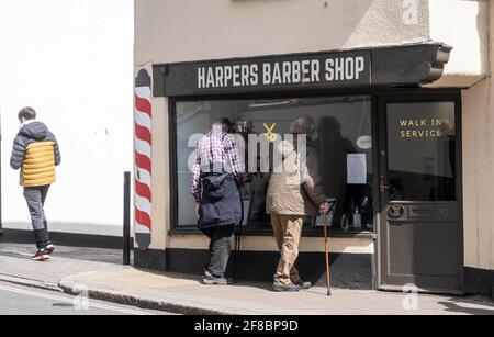 Men queue outside Just Men barbers in Leeds, as coronavirus lockdown ...