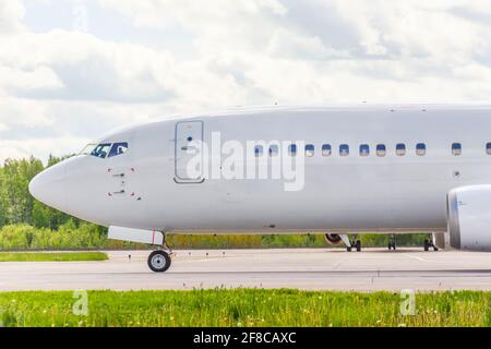 Passenger airplane portholes nose cockpit, side view Stock Photo - Alamy