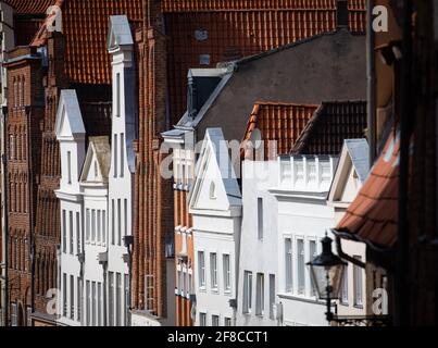 12 April 2021, Schleswig-Holstein, Lübeck: Facades and gables of ...