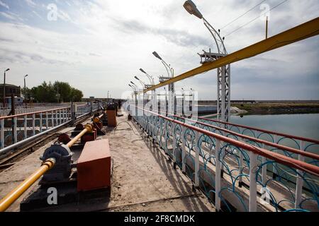 Kazakhstan, Shardara water storage dam. Group of Uzbek workers mixing ...