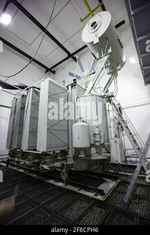 New modern electric transformer room building with grey doors and ...