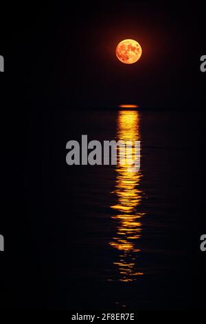 Details of full red moon over dark black sky by night. The total phase ...