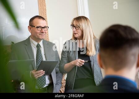 Collaboration and analysis by business people working in office Stock ...