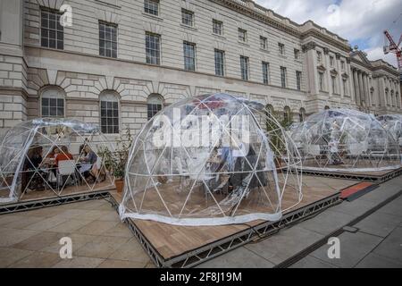 Friends enjoy one of Somerset House’s igloo-style dining domes where ...