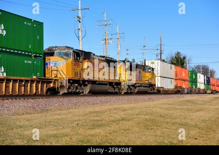 Geneva, Illinois, USA. A helper locomotive cut in mid train helps to ...