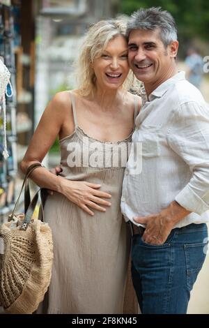 Happy Caucasian man buying things online, using smartphone and credit ...
