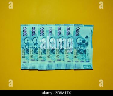 Top view of Mexican 1000 banknotes isolated on yellow background Stock ...