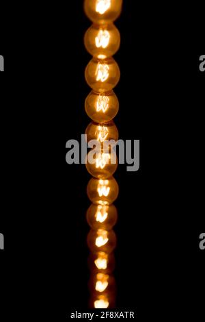 Plenty light bulbs shining bright Stock Photo - Alamy