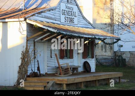 Front porch of an old country store with vintage signs and other ...