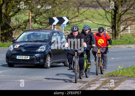 A cyclist on a bike lane passing the Lijnbaan shopping precinct in ...