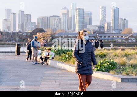 A woman walks in the sun in London, Tuesday, June 23, 2026, as a heat ...