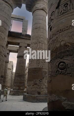 Tall columns of historical complex of Karnak temple with carved ancient ...