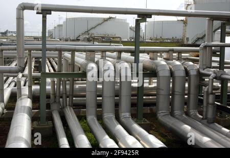Storage tanks at oil facilities stand on Lake Maracaibo in Cabimas ...