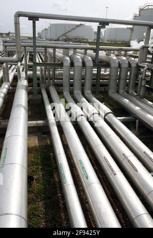 Storage tanks at oil facilities stand on Lake Maracaibo in Cabimas ...
