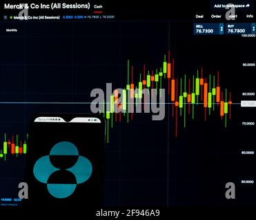 In this photo illustration a Merck logo seen displayed on a smartphone ...
