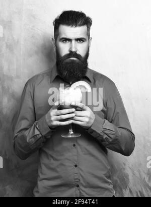 Brutal caucasian hipster holding tropical alcoholic fresh cocktail ...