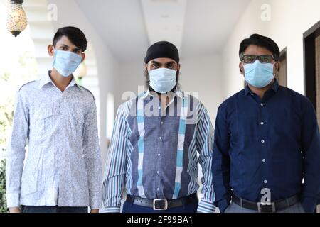 Asian men observing basic health protocols against Covid-19 by wearing ...