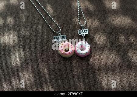 Pendant set of best friends two colors heart necklace shoot outside in ...
