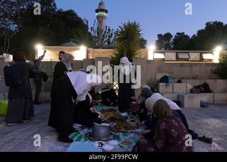 Palestinians break their fast by eating the Iftar meals during the holy ...