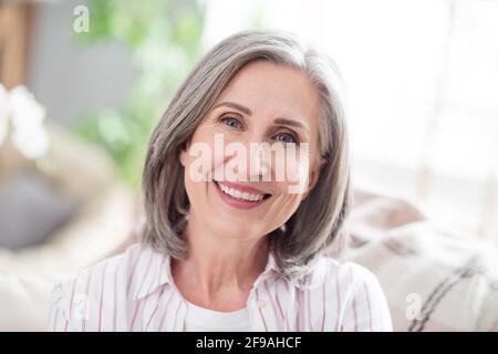 Photo of pretty cute retired woman blue sweater showing okey sign ...