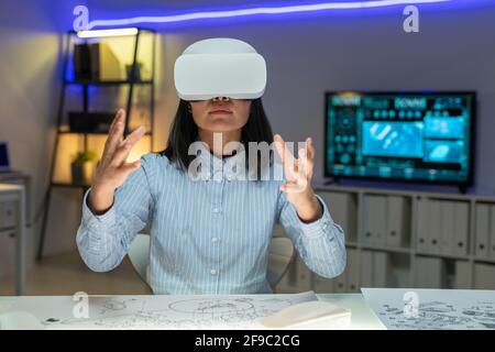 Concentrated businessman in headset looking at computer screen and ...