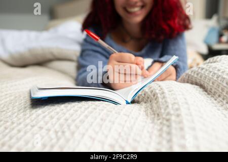 Gen Z writing in her journal Stock Photo - Alamy